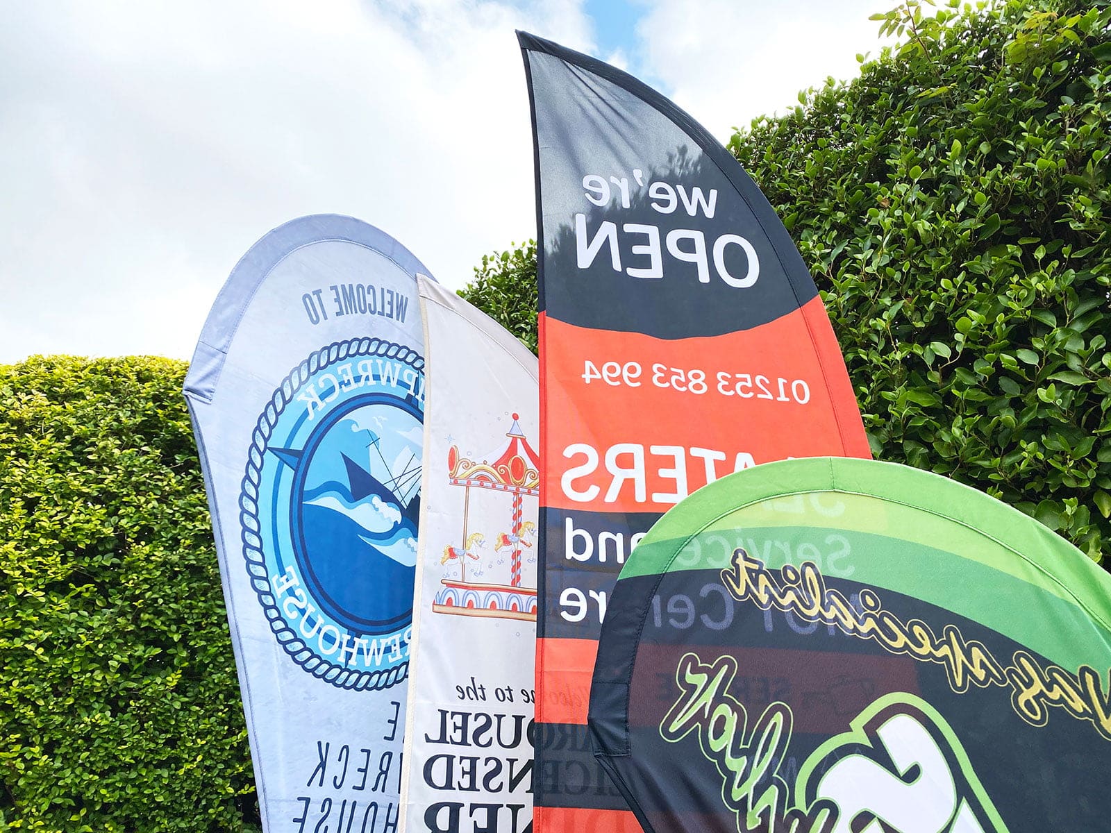 Feather Flags: An Effective and Eye-Catching Advertising Solution ...